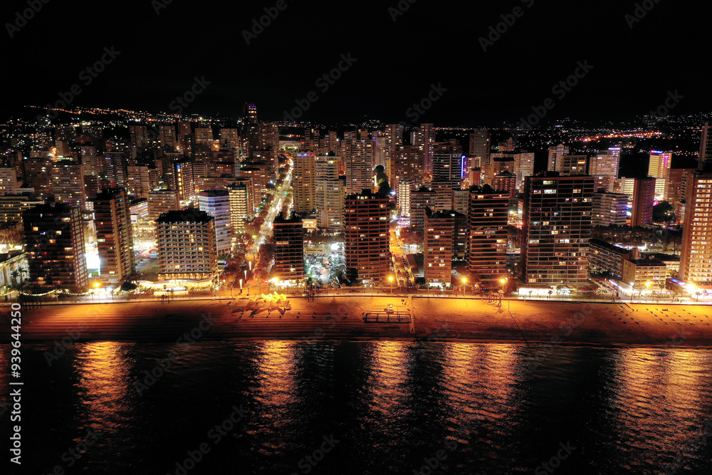 Skyline of Spanish city Benidorm, at night. Street lights. Light ...
