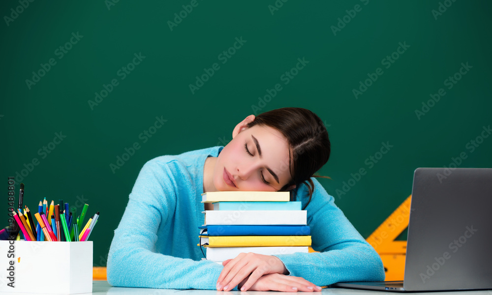 Student sleeping during a lecture in a classroom. Portrait of tired ...