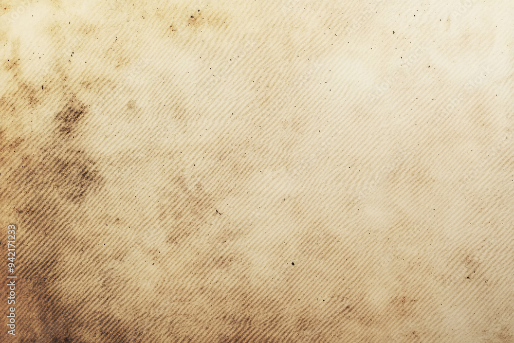 Aged vintage paper texture with fading and discoloration creating a ...