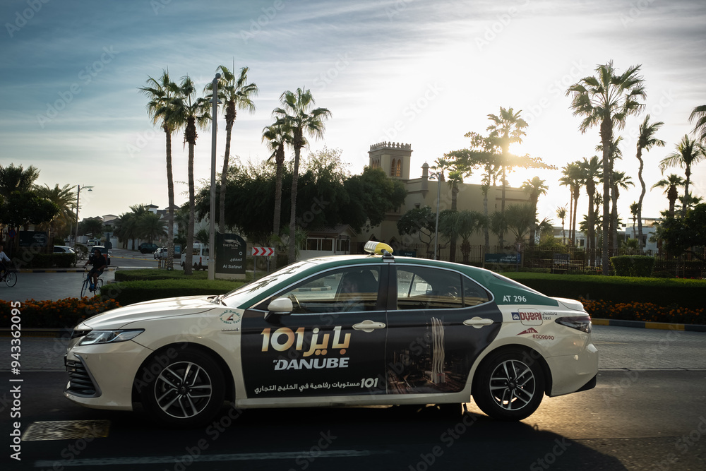 Toyota taxi car driving on an urban road of Dubai. City taxi. Dubai ...
