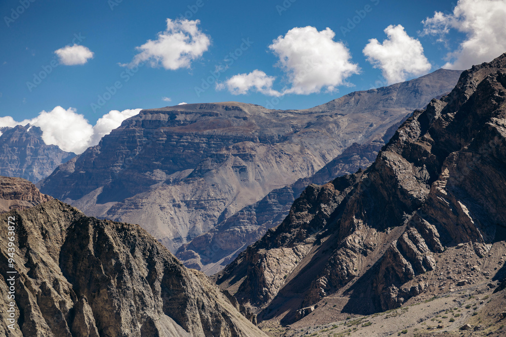 Rugged mountain ridges in the Himalayas of Spiti Valley, illuminated by ...