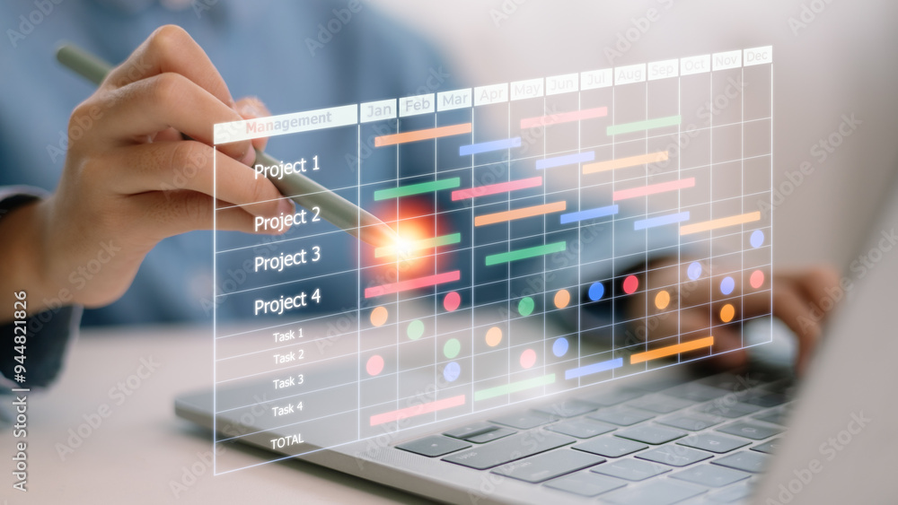 The project manager works and updates tasks with milestones and ...
