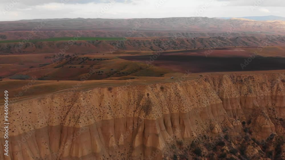 Aerial top view 4wd vehicle isolated drive on mars alike landscape ...
