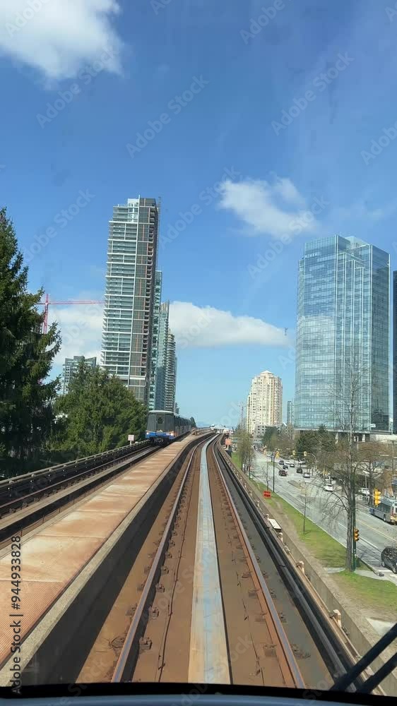 Landscape view of the front view of skytrain in Vancouver city-see ...