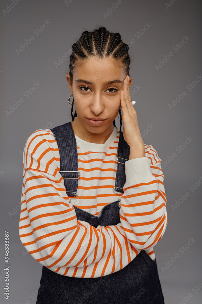 Vertical waist up portrait of smug young woman with cornrows hairstyle ...