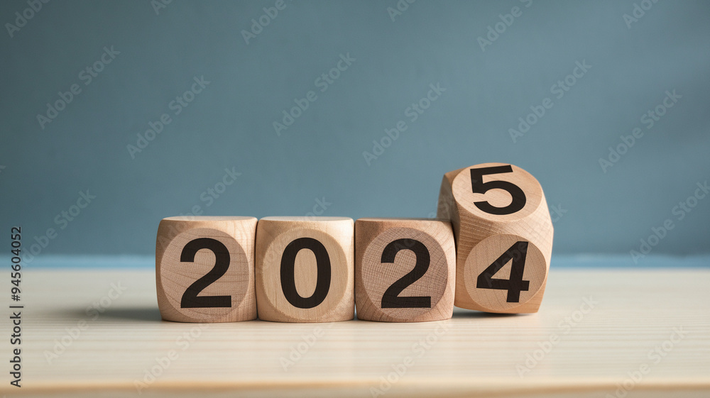 2025 . Four wooden blocks are arranged in a row, displaying the numbers ...