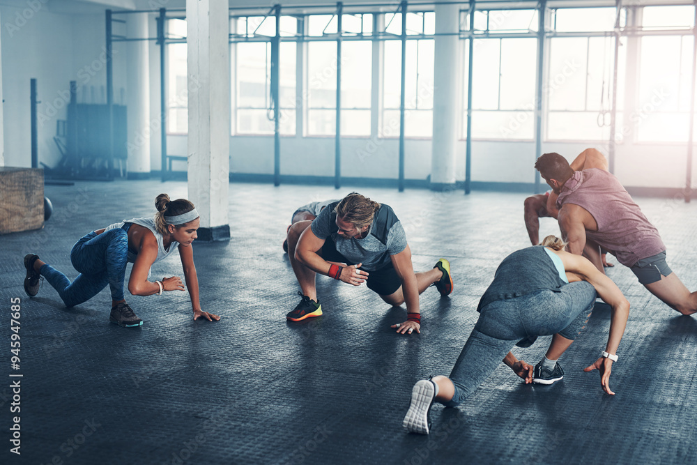 Fitness, floor and stretching with people in gym together for physical ...