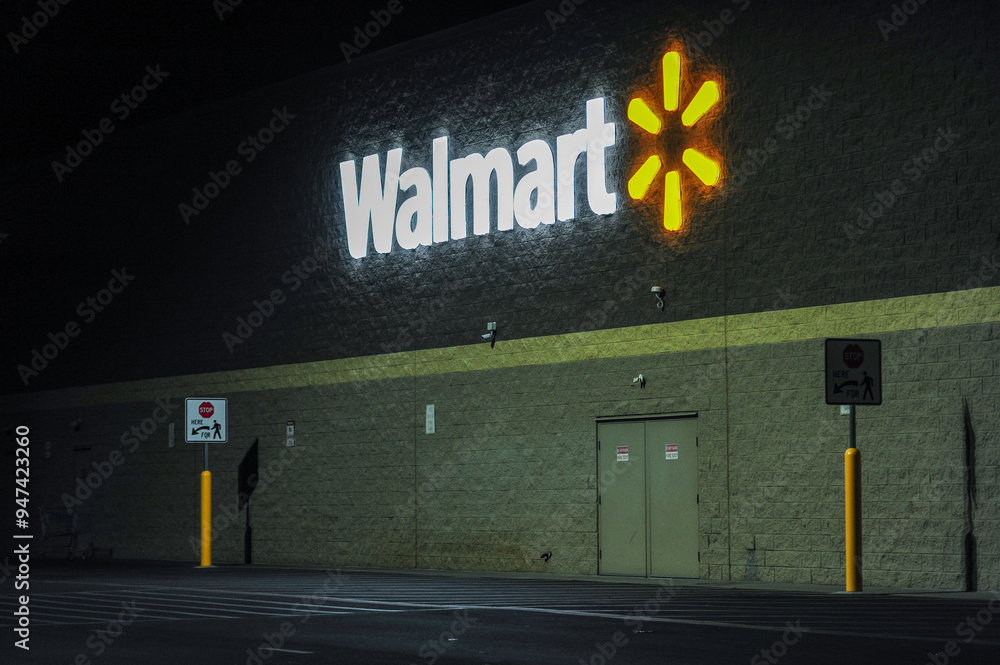 Exterior night view of a Walmart Supercenter in Arizona, showcasing its ...