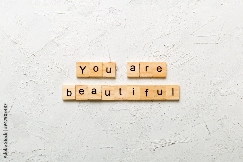 You are beautiful word written on wood block. You are beautiful text on ...