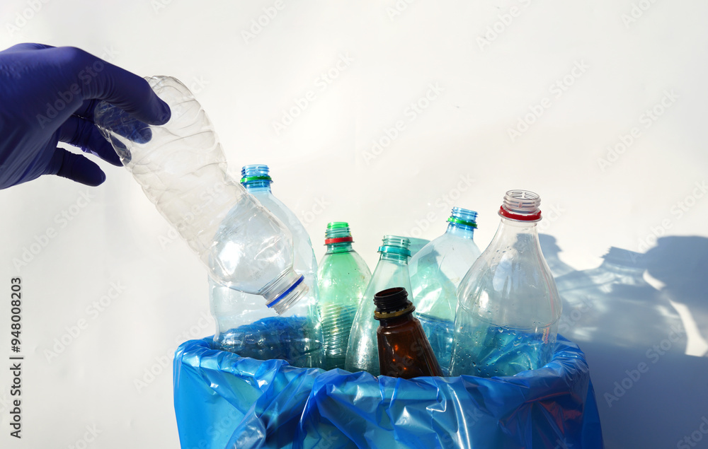 Plastic sorting for Recycling. Empty plastic bottles in trash bin ...