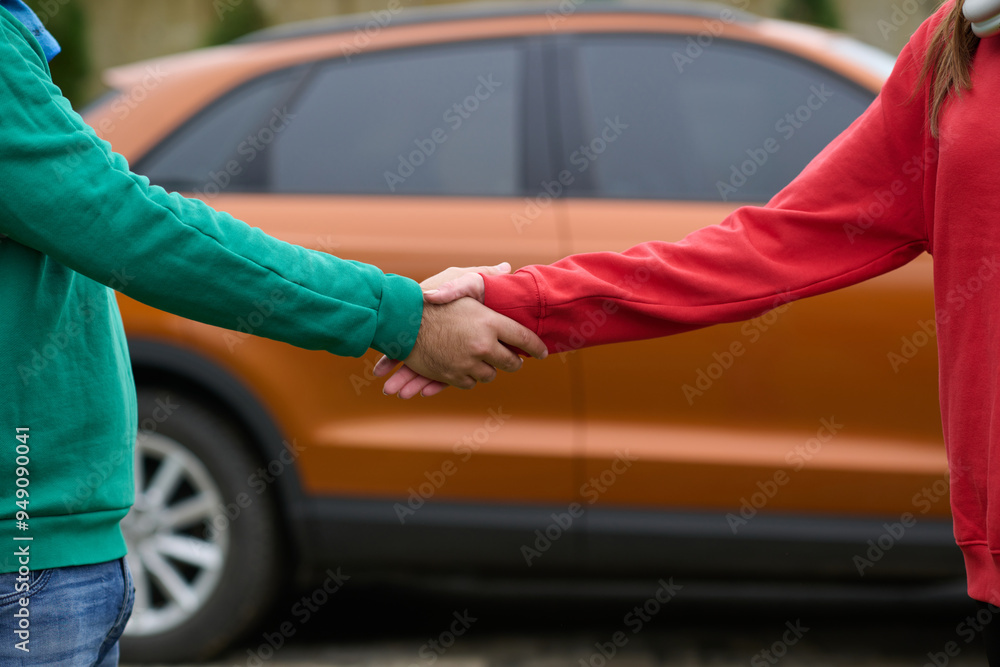 Car keys handshake, seller or car salesman and customer in a dealership ...
