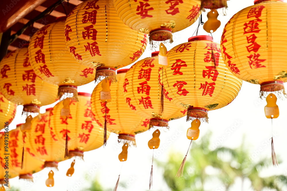 Taiwan - Jan 17, 2024: Yellow lanterns at Taipei Bao An Temple display the phrases "Feng Tiao Yu ...