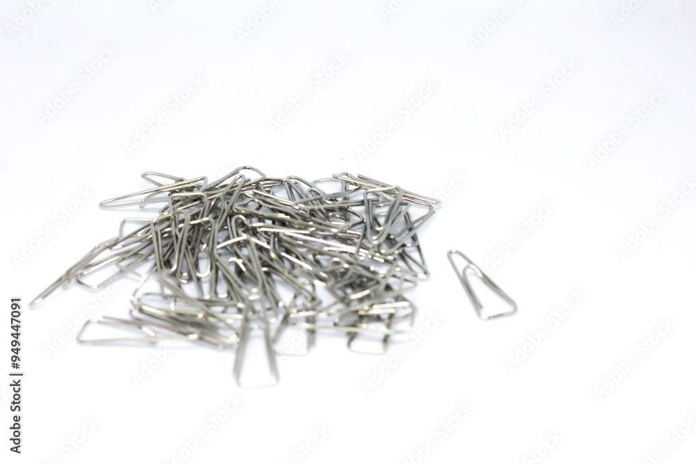 iron paper clip isolated on white background. This clip is often used ...