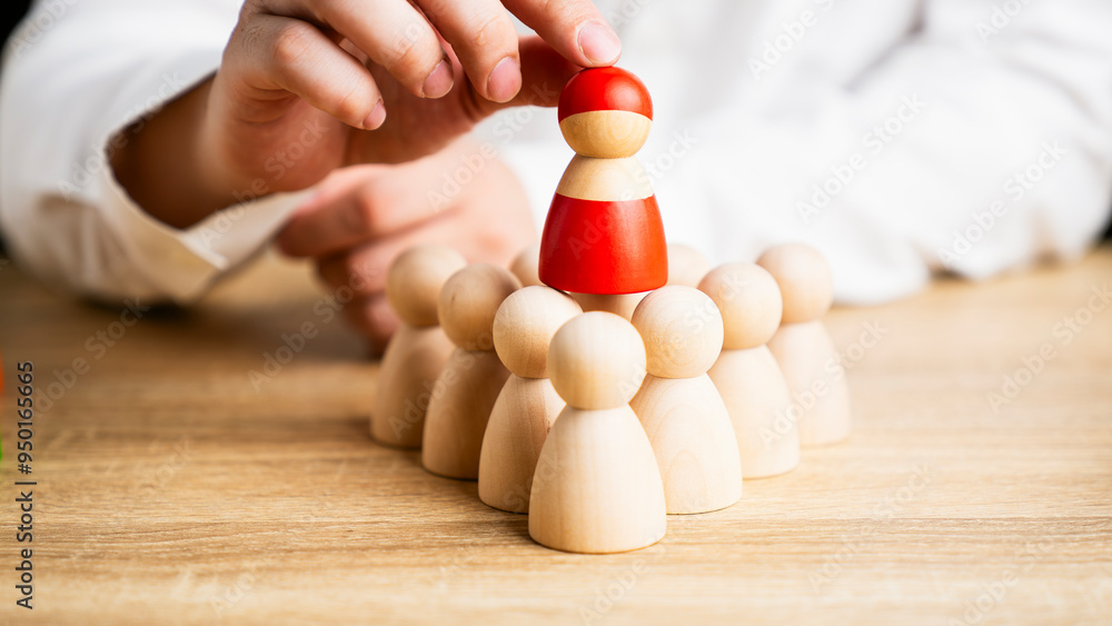 Red wooden figure to leader of group, talking influence, empowerment ...