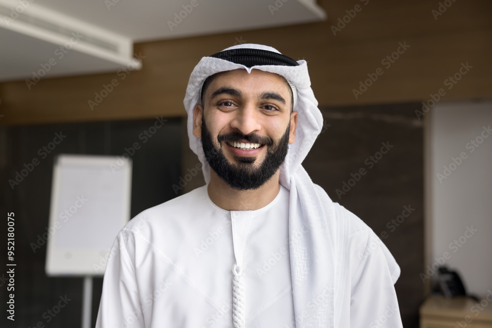 Cheerful successful Arab business leader man wearing keffiyeh, looking ...