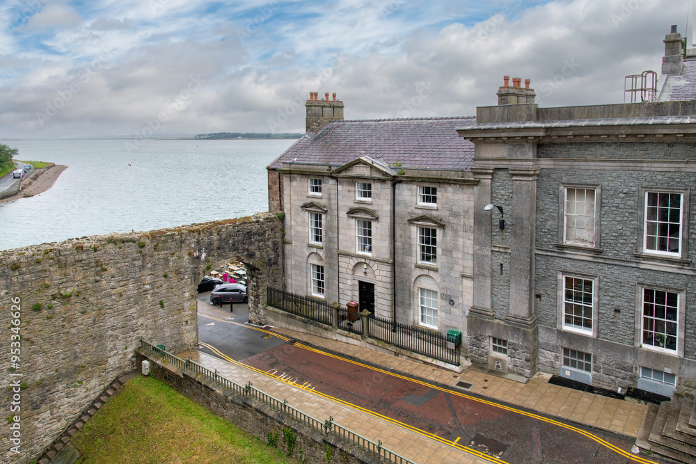 High level view over Caernarfon, UK and sea next to medieval fortress ...