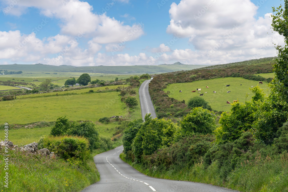 Drivers perspective of winding road through the hilly landscape of ...
