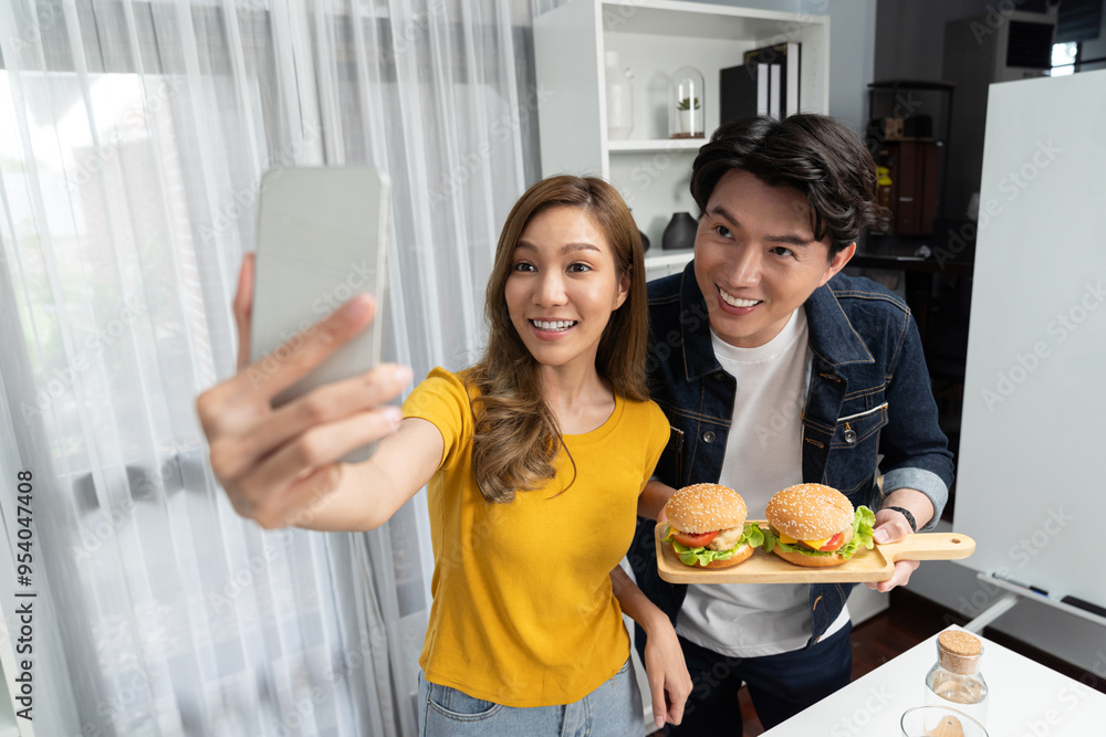 Smiling host chef influencers taking photo with smartphone by selfie ...