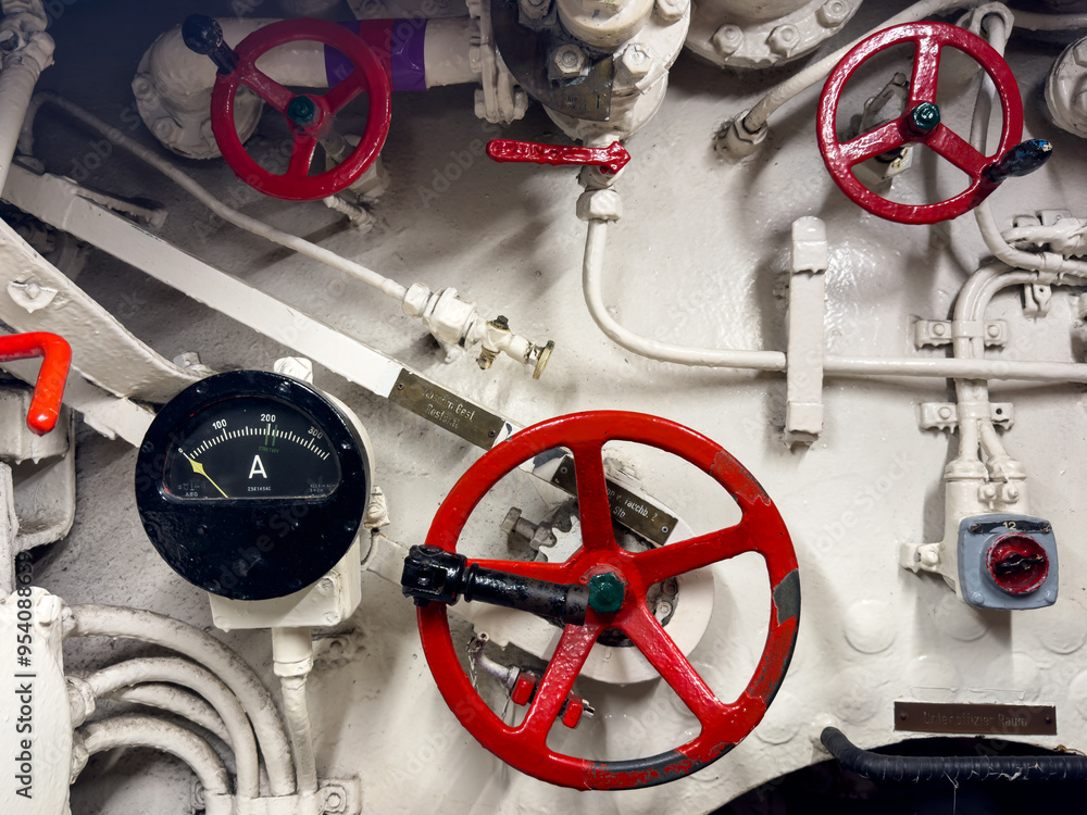 Old retro style red rotating wheel shutoff valve and instrument panel ...