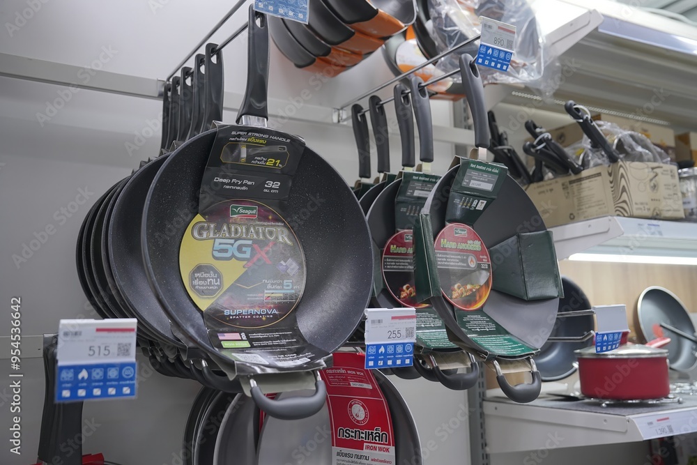 A display of various non-stick frying pans on sale in a kitchenware ...