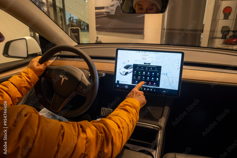 Man test driving Tesla car model Y, experiencing comfort and innovation ...