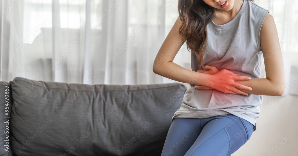Young woman experiencing abdominal pain, uterus pain, reproductive ...