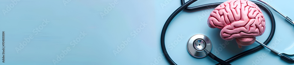 Top view of a stethoscope and a brain model placed on a blue ...
