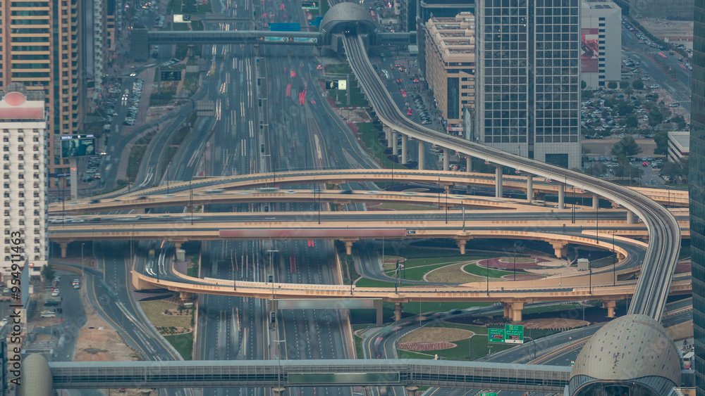 Aerial view of highway junction with traffic timelapse in Dubai, UAE ...