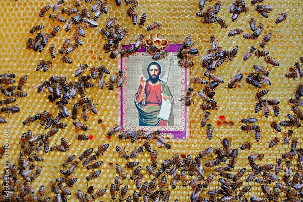 Honeycomb with Orthodox icon of Jesus Christ and working bees on ...