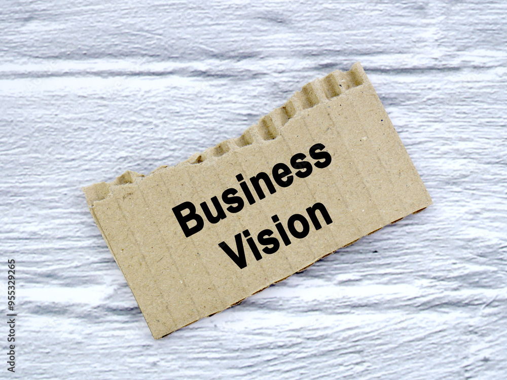 Business vision wording or text on ripped paper edge cardboard with ...