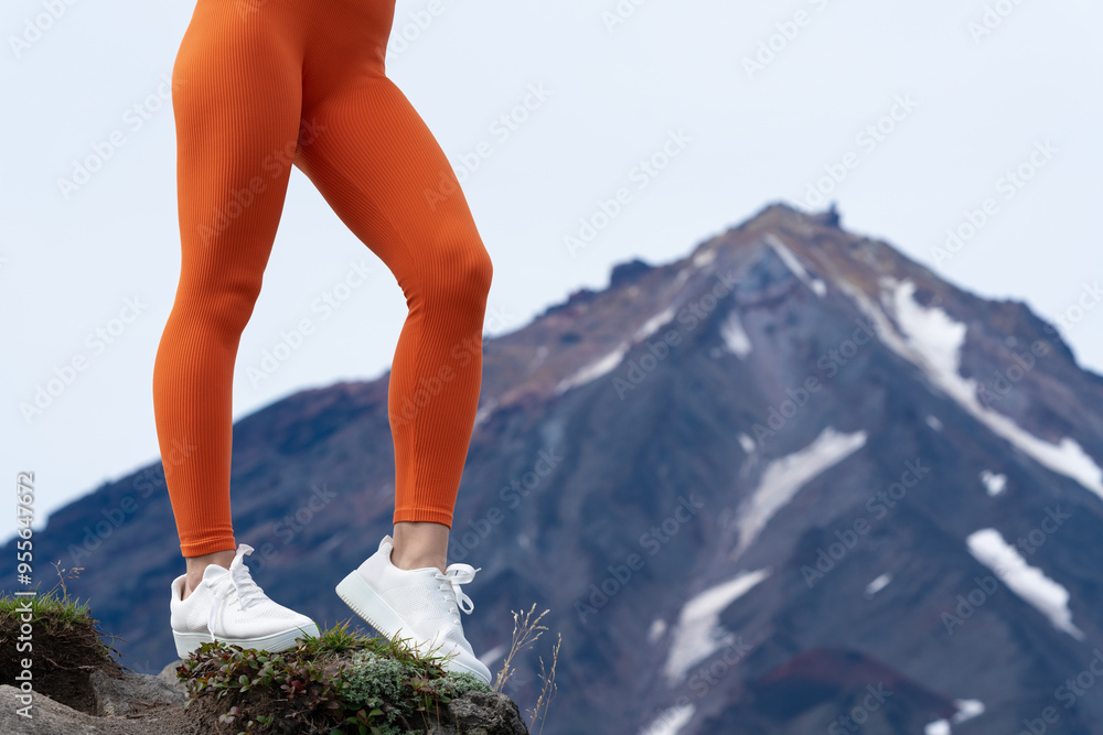 Woman dominates landscape with commanding presence as she performs ...