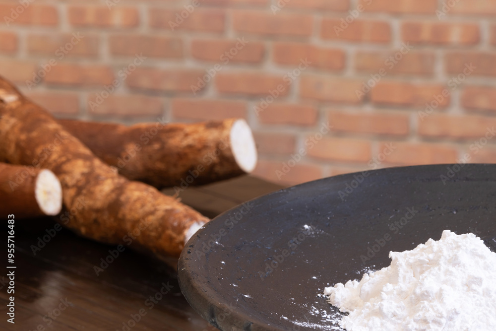 Cassava starch inside a clay plate on the right of the image and ...