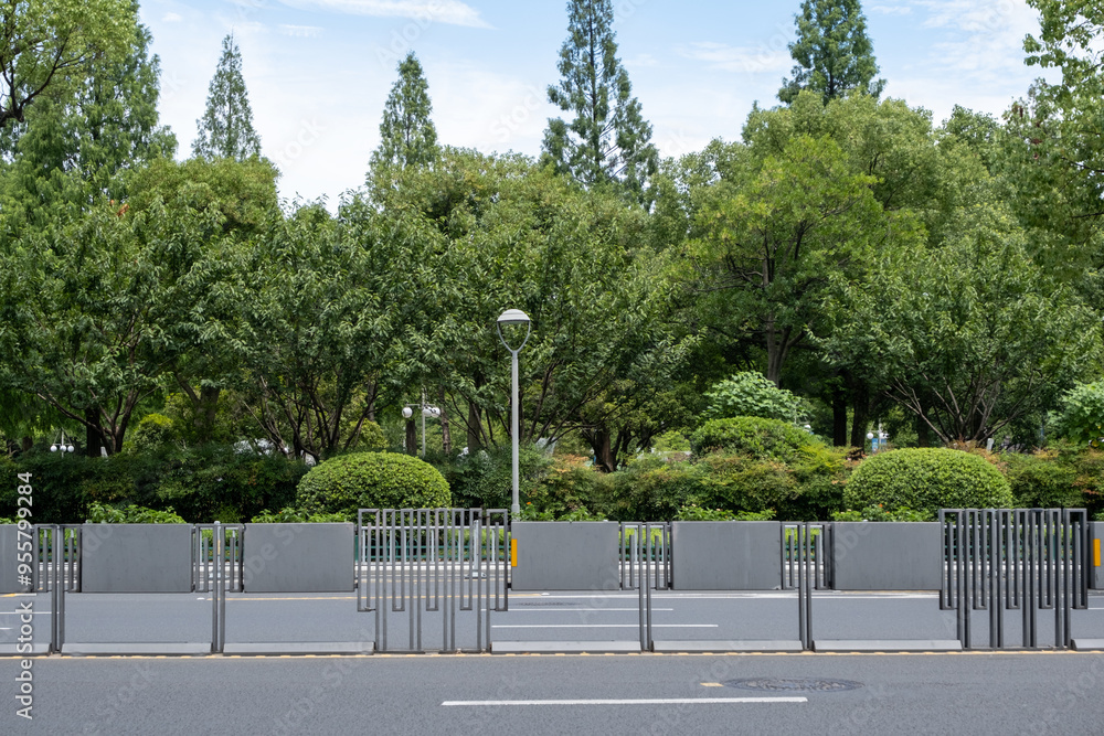 A concrete and metal barrier as a median strip separates lanes ...