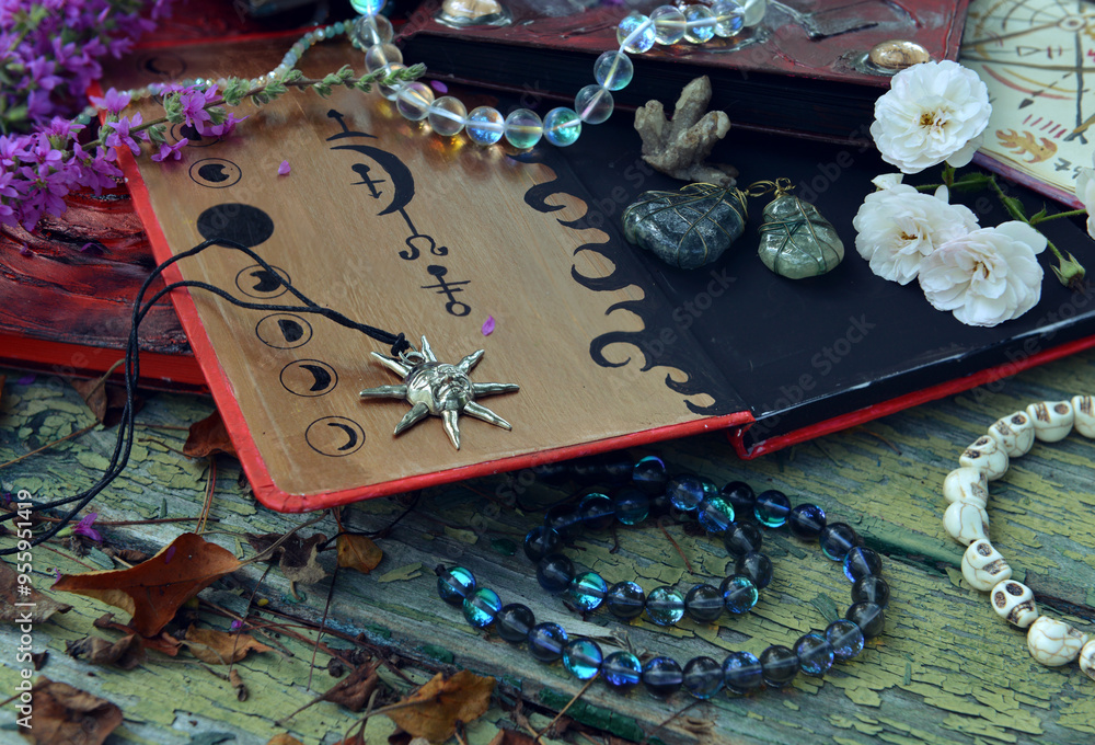 Mystic still life with magic book of spells, crystals, flowers and ...