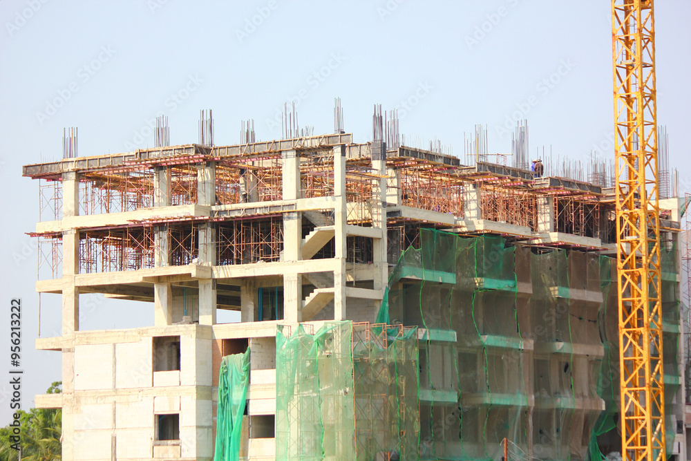 reinforced concrete building under consruction in construction site ...