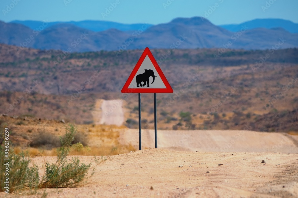 Warning sign - elephants crossing the street. Scenic road in Namib ...