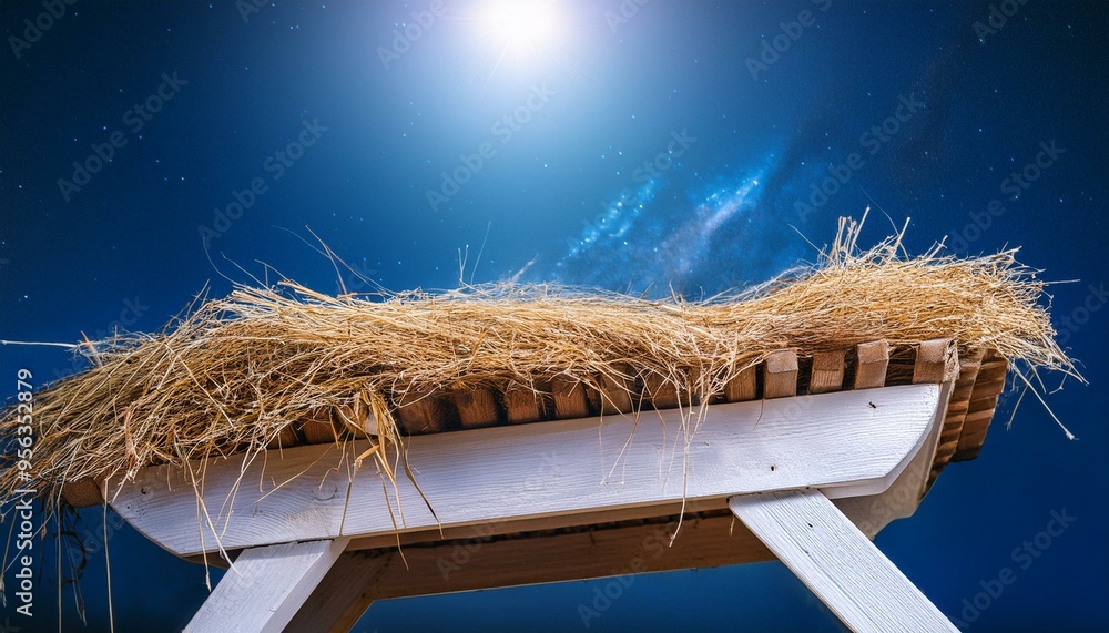 Manger in the Glow of the Star A close-up of the manger bathed in a ...