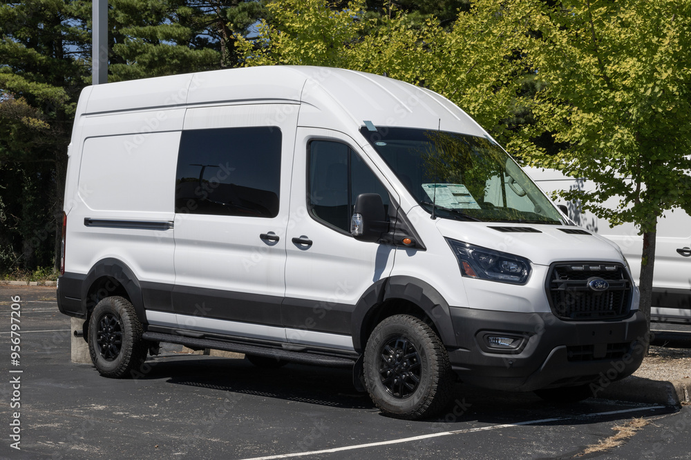 Ford Transit 350 HR Cargo Van display at a dealership. Ford offers the ...