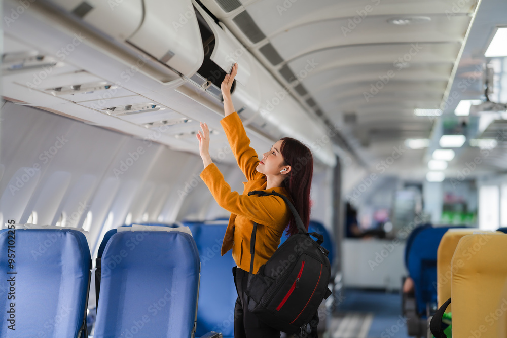 Woman Boarding Plane: A young woman in a yellow blazer and backpack ...