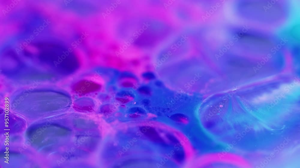 Bubble fluid. Wet foam. Defocused neon pink purple blue color glitter ...