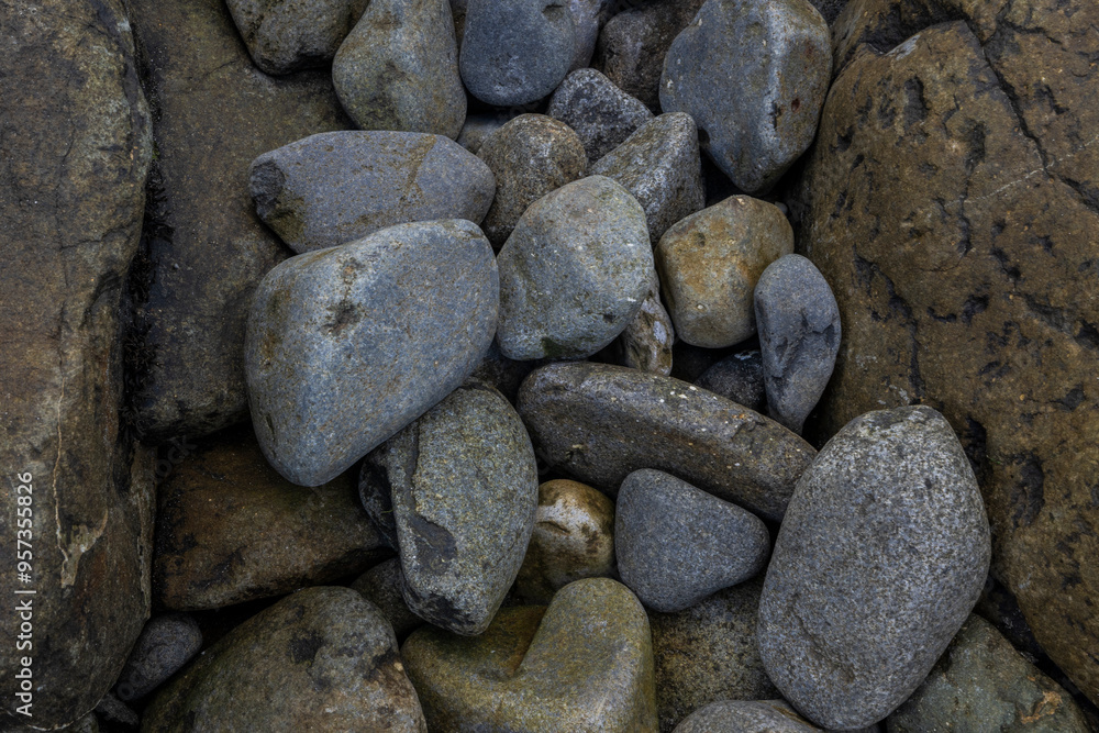 A group of rocks outdoors, featuring various types such as boulders ...
