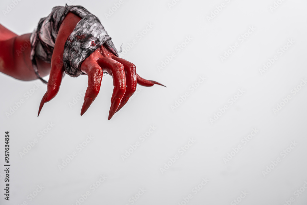 A terrifying red demon hand wrapped in a shroud, reaching out ...