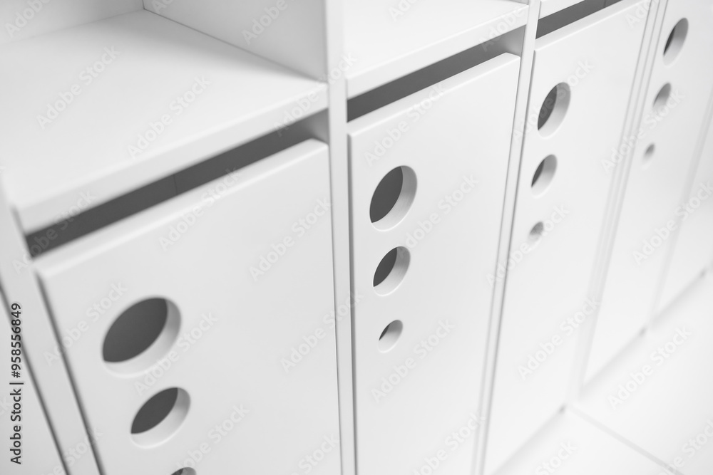White lockers with circular cutout handles in a minimalist design ...