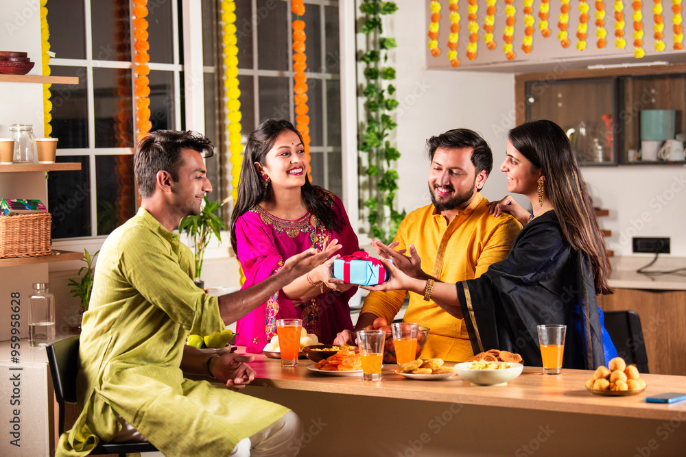 Happy Indian family and friends celebrating Diwali at home, sharing ...