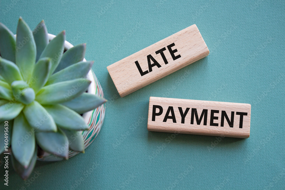 Late payment symbol. Concept word Late payment on wooden blocks ...