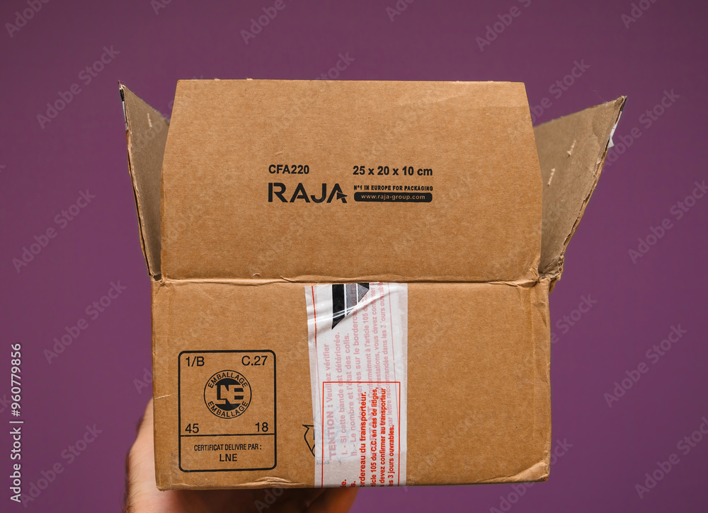 Berlin, Germany - Oct, 22, 2019: A hand holding an open Raja cardboard ...