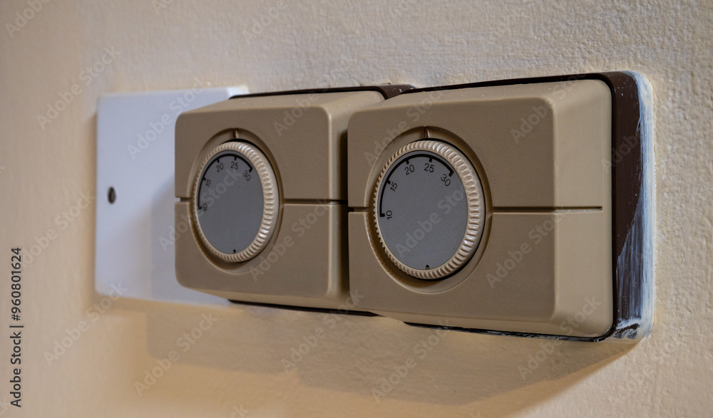 Poster The room thermostat on the wall is being adjusted – Wall Art ...