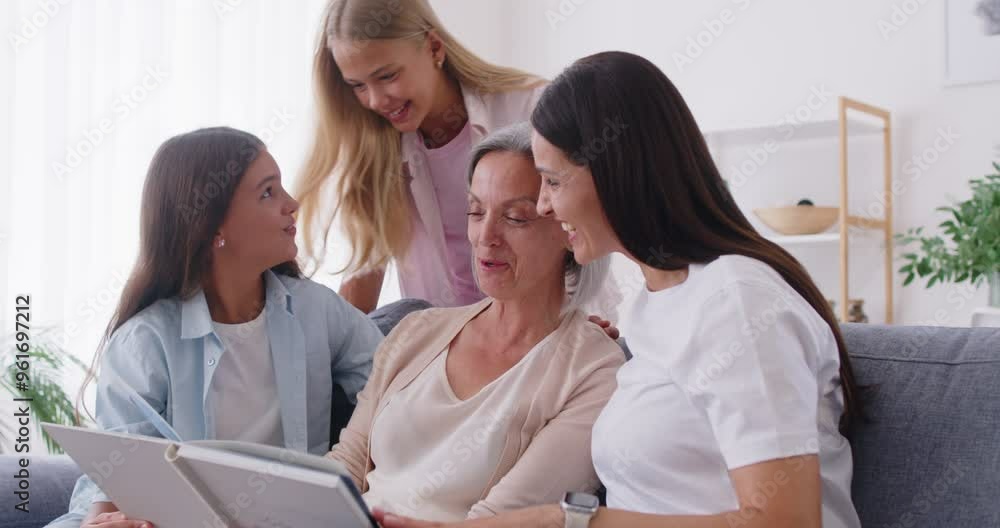 Happy multi generation family with two daughters, mother and ...