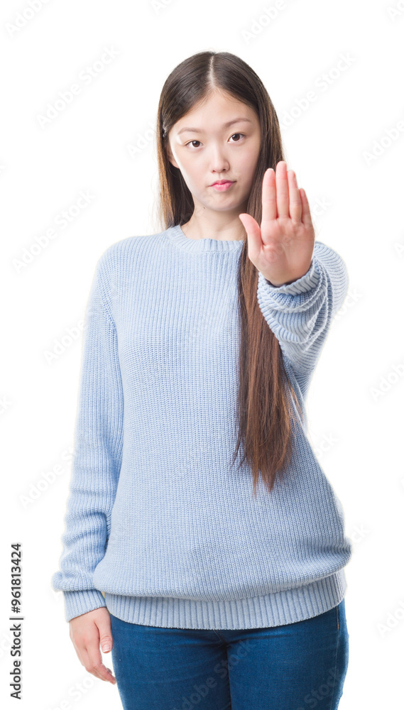Young Chinese woman over isolated background doing stop sing with palm ...