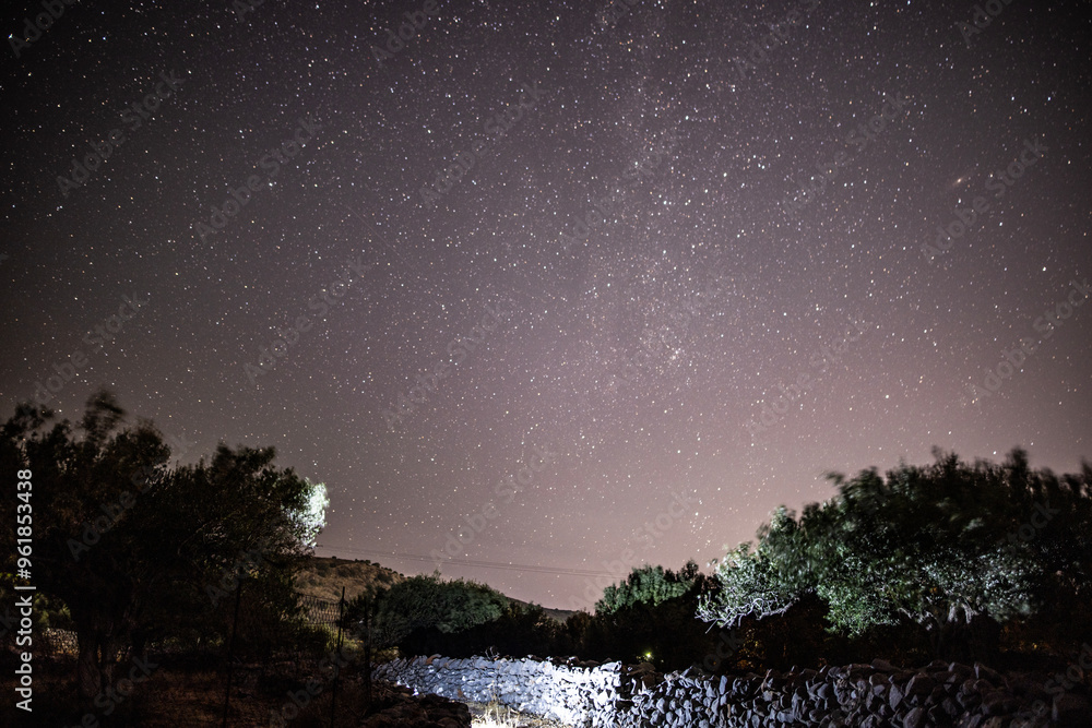 night panoramic landscape with starry sky on the island of Crete in ...